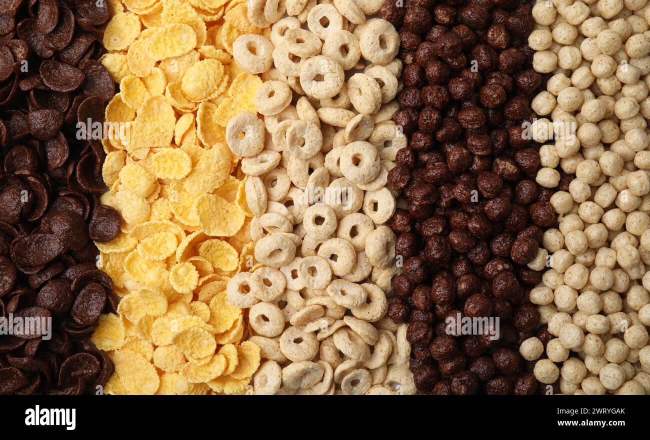 Different types of breakfast cereals as background, top view Stock ...