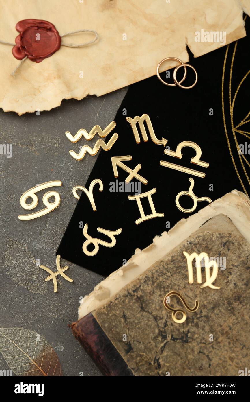 Flat lay composition with zodiac signs on grey textured table Stock ...