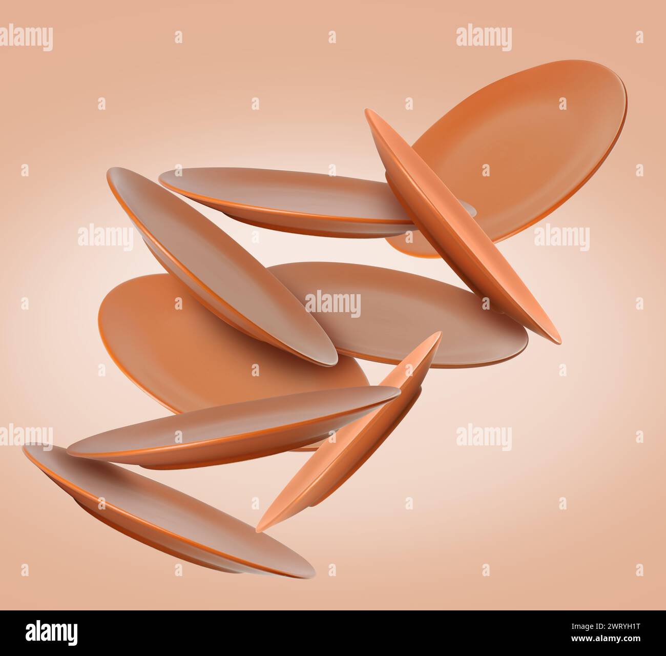 Clean ceramic plates falling on pale orange background Stock Photo - Alamy
