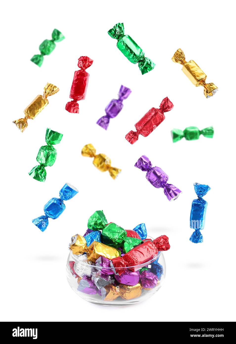 Tasty candies in bright wrappers falling on white background Stock ...