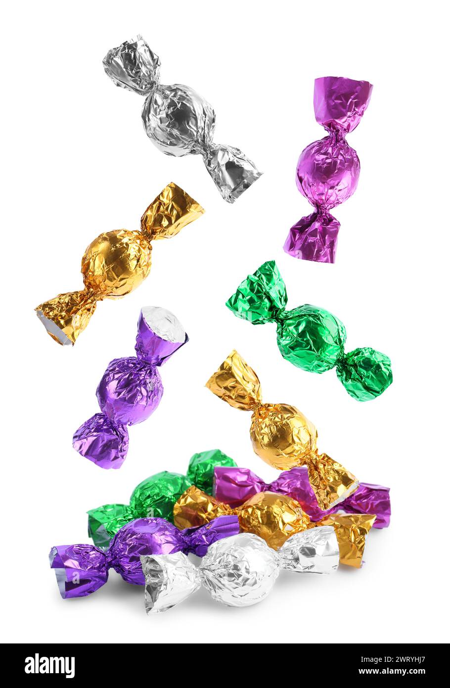 Tasty candies in bright wrappers falling on white background Stock ...