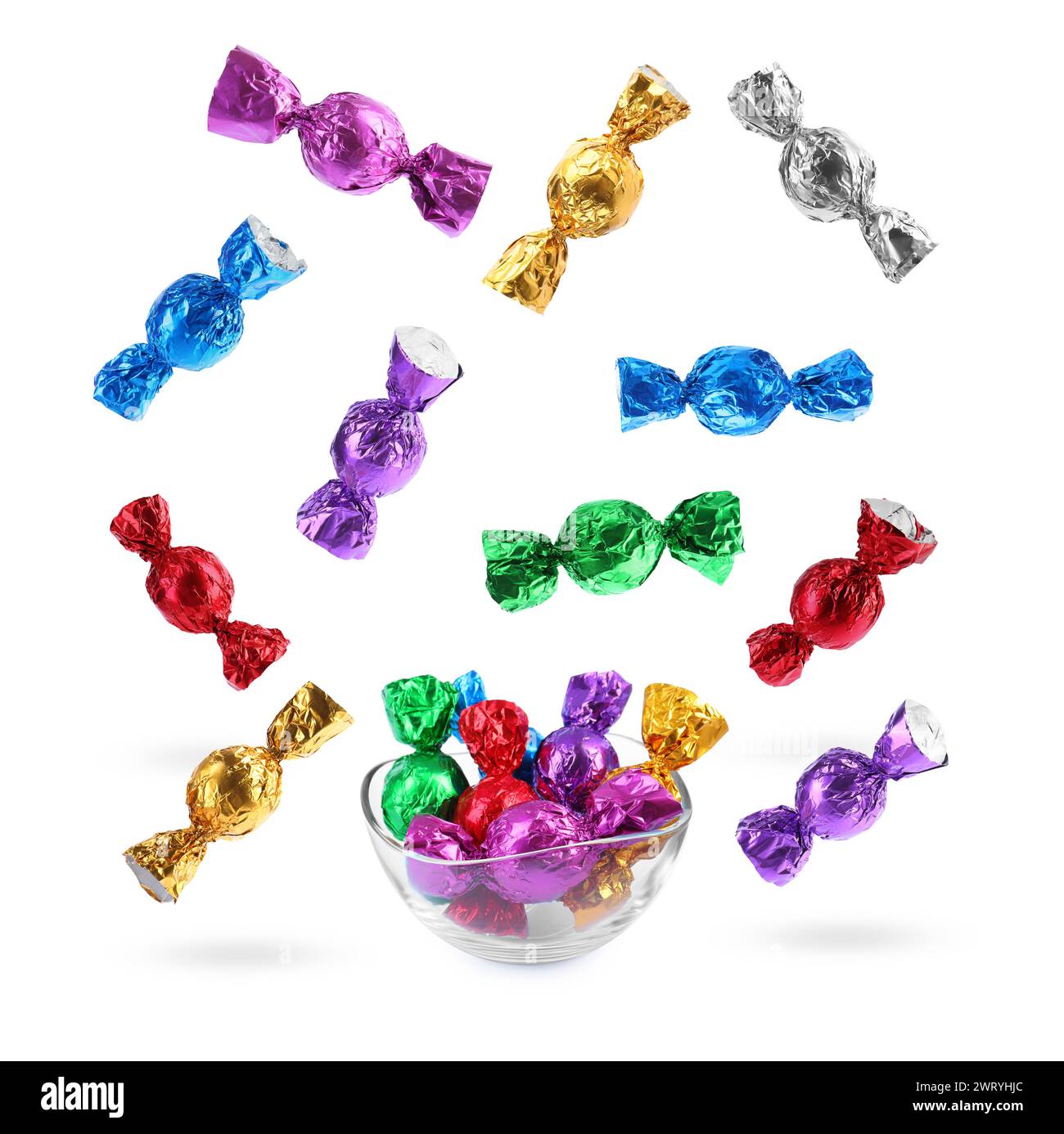 Tasty candies in bright wrappers falling on white background Stock ...