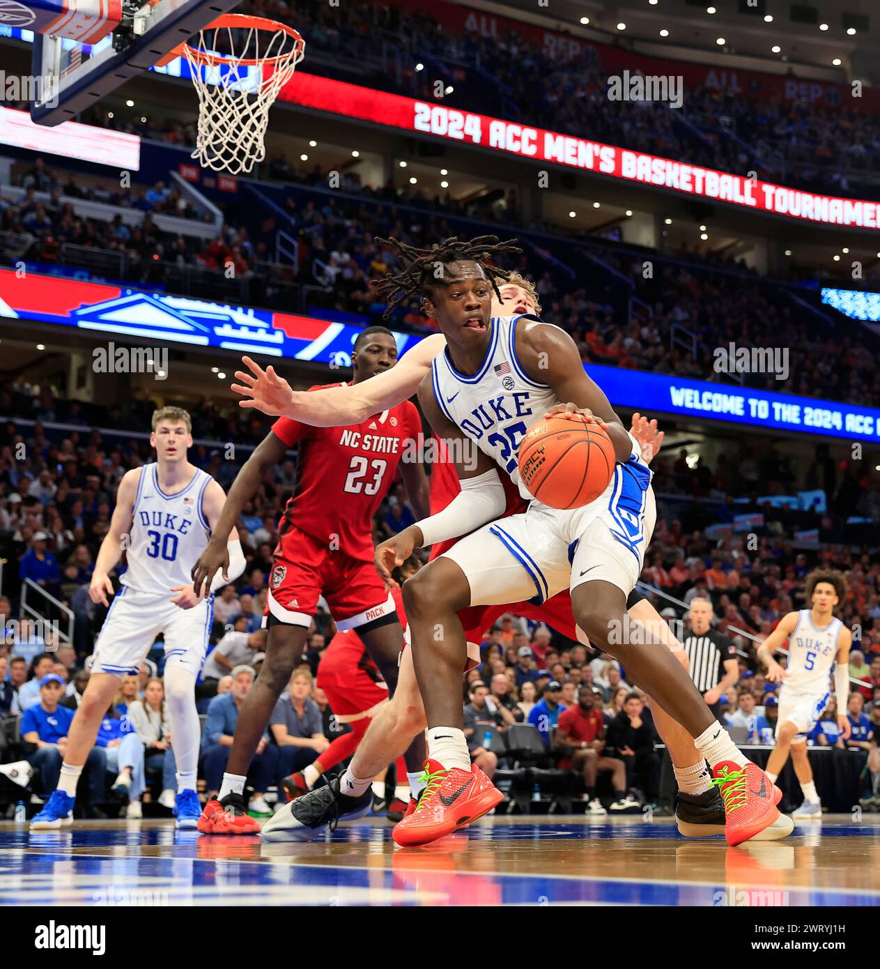 March 14, 2024: Duke Blue Devils Forward (25) Mark Mitchell controls ...