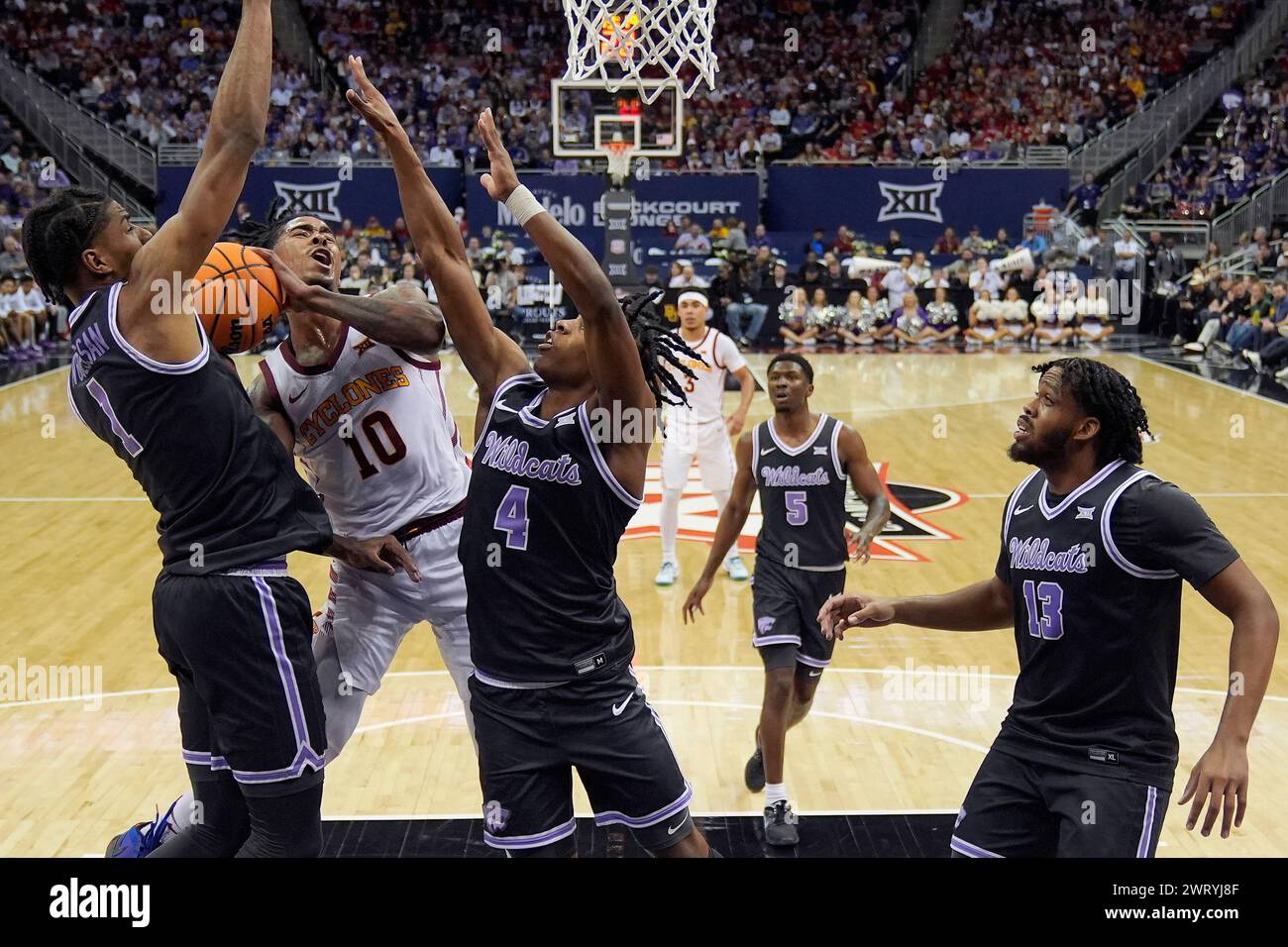 Iowa State guard Keshon Gilbert (10) looks to shoot between Kansas ...