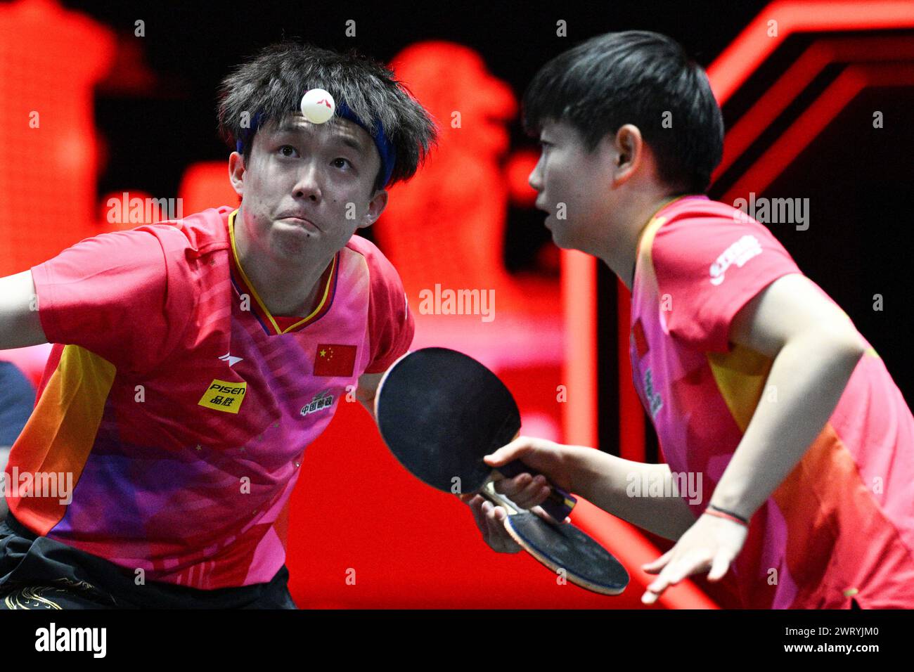 Singapore. 14th Mar, 2024. Sun Yingsha/Wang Chuqin (L) of China compete ...