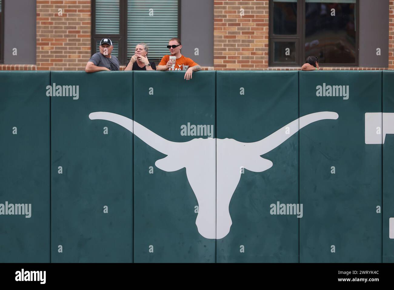AUSTIN, TX - MARCH 14: Fans stand on the left field wall over the Texas ...
