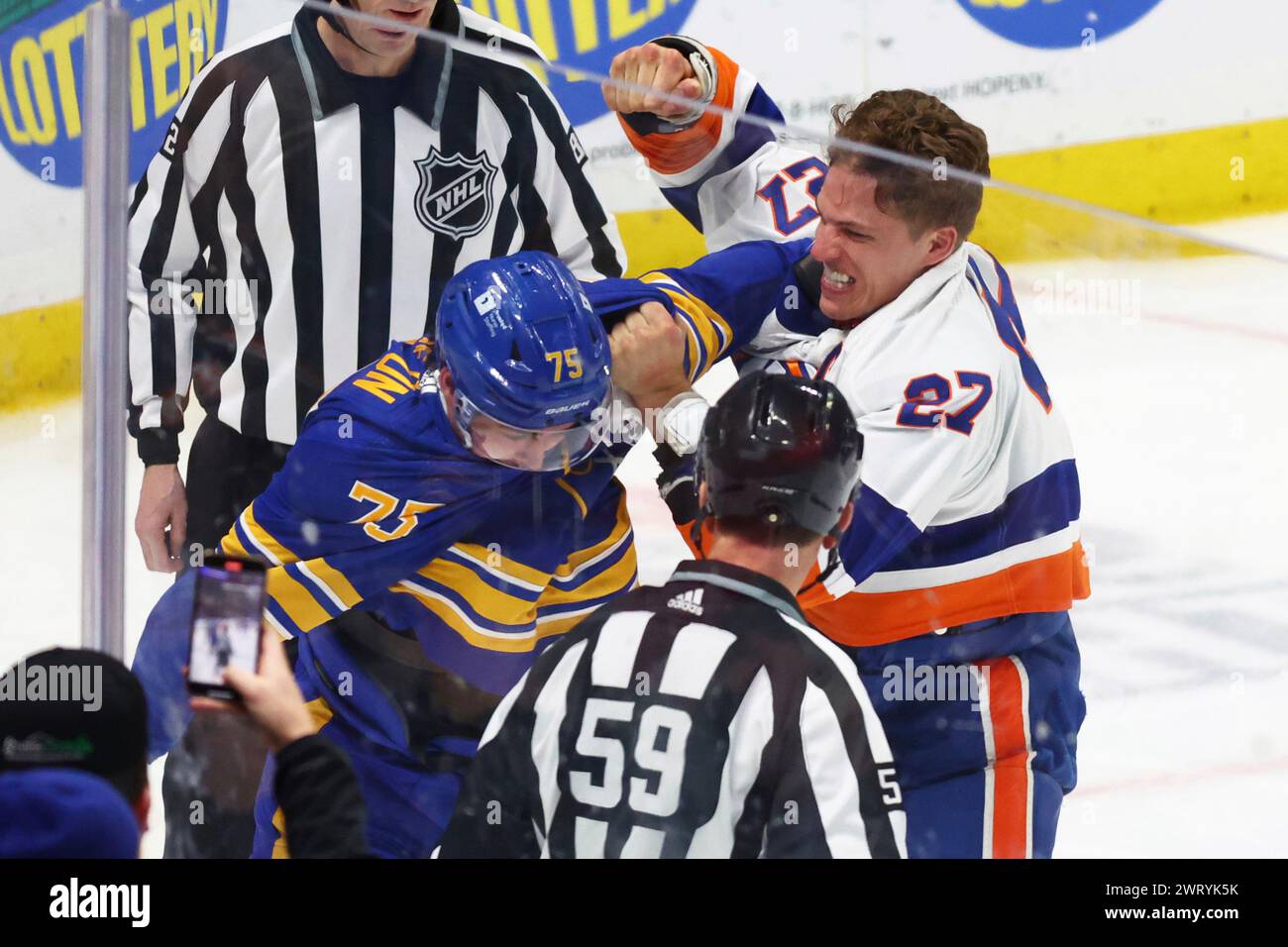 Buffalo Sabres defenseman Connor Clifton (75) and New York Islanders ...