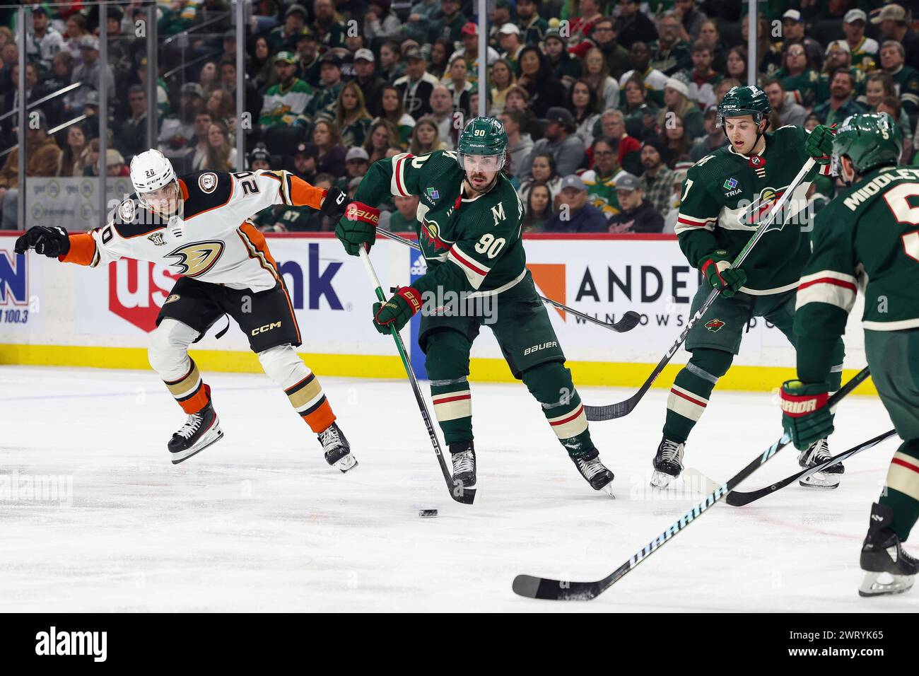 Minnesota Wild center Marcus Johansson (90) controls the puck next to ...