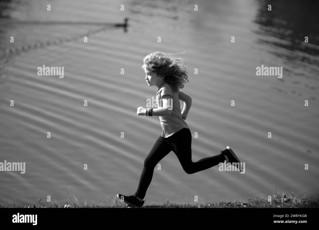 Child boy jogging in park outdoor. Sporty kid running in nature. Active ...