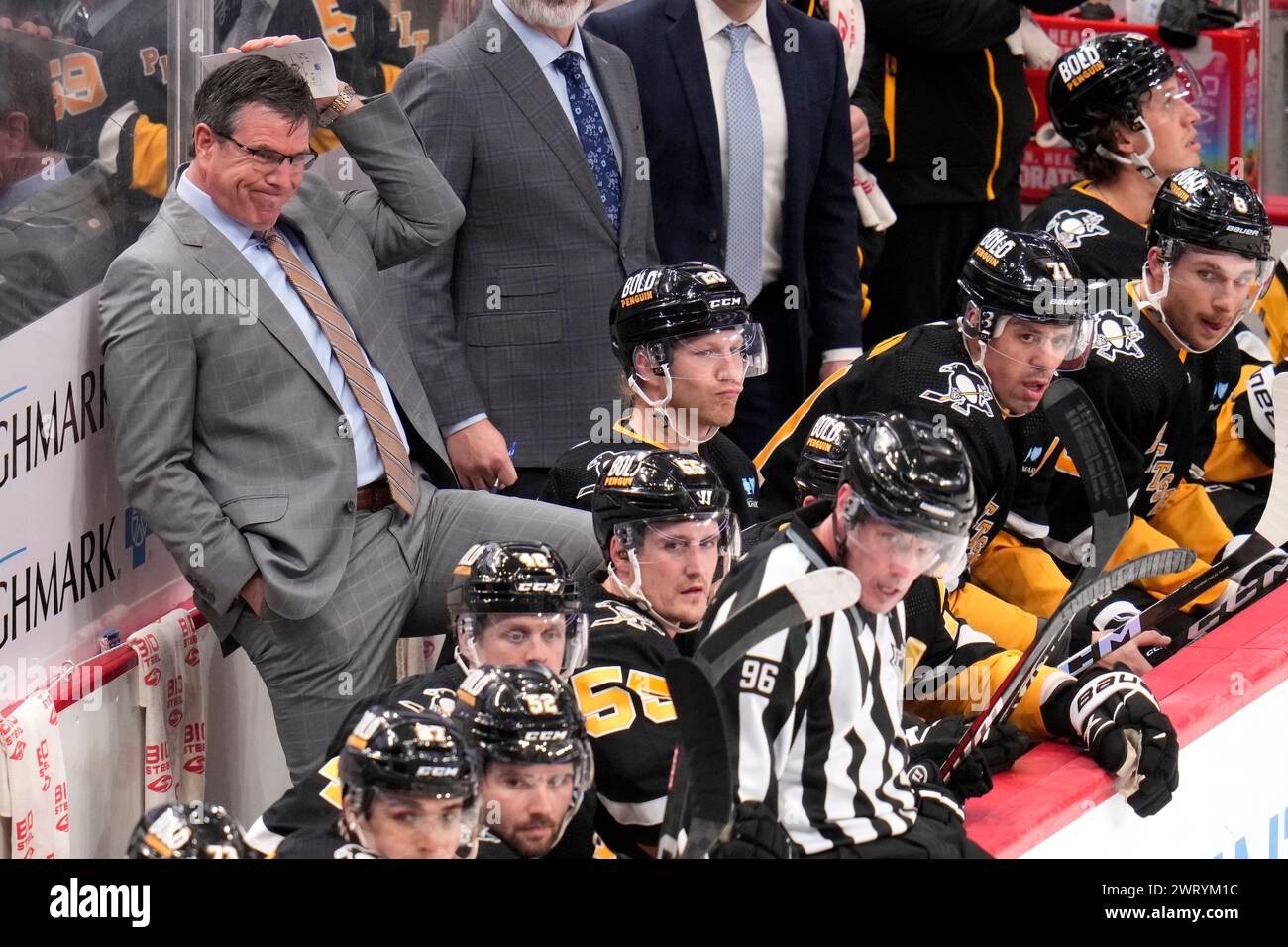 Pittsburgh Penguins head coach Mike Sullivan, left, stands behind his ...