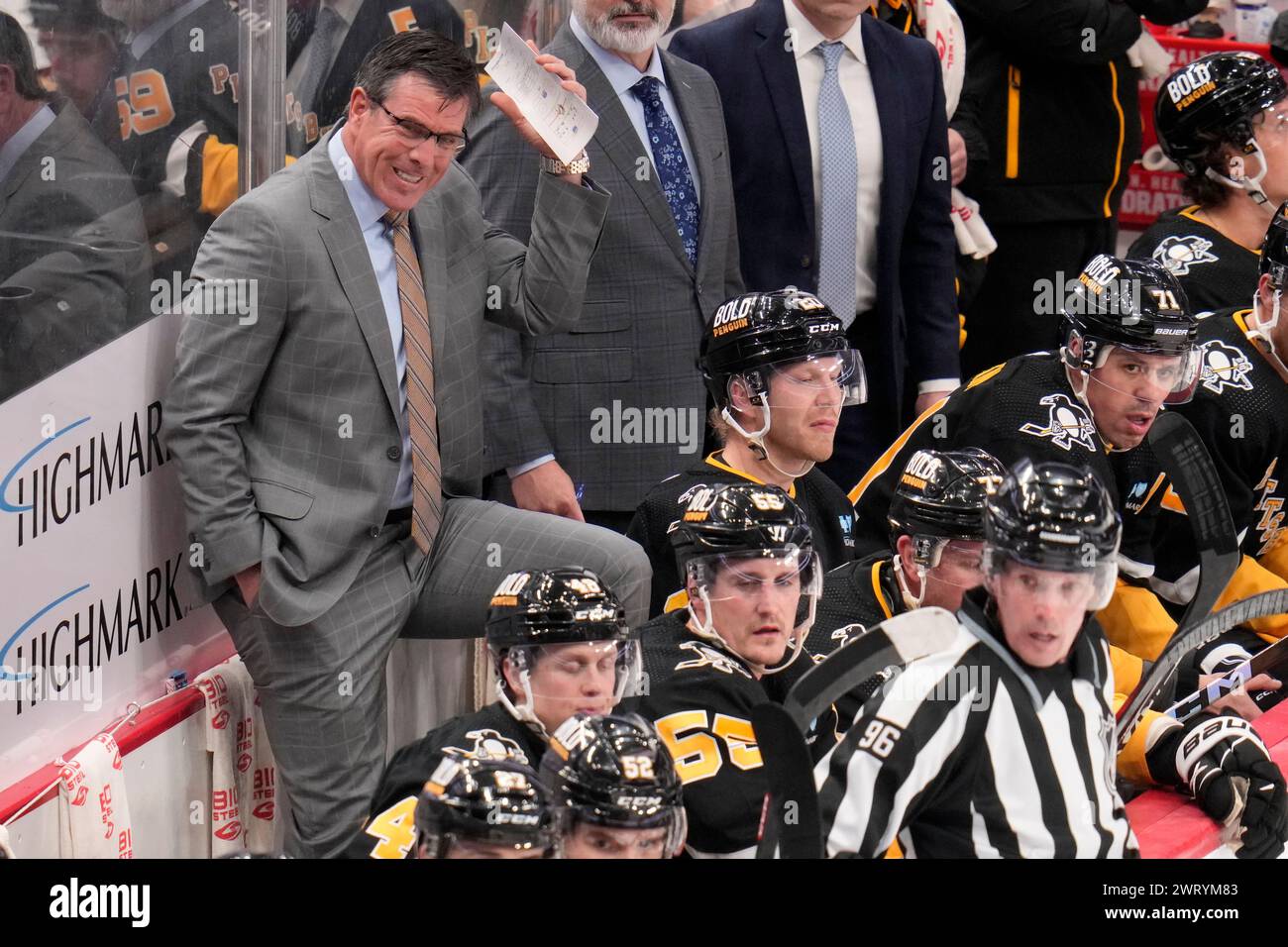Pittsburgh Penguins head coach Mike Sullivan, left, stands behind his ...
