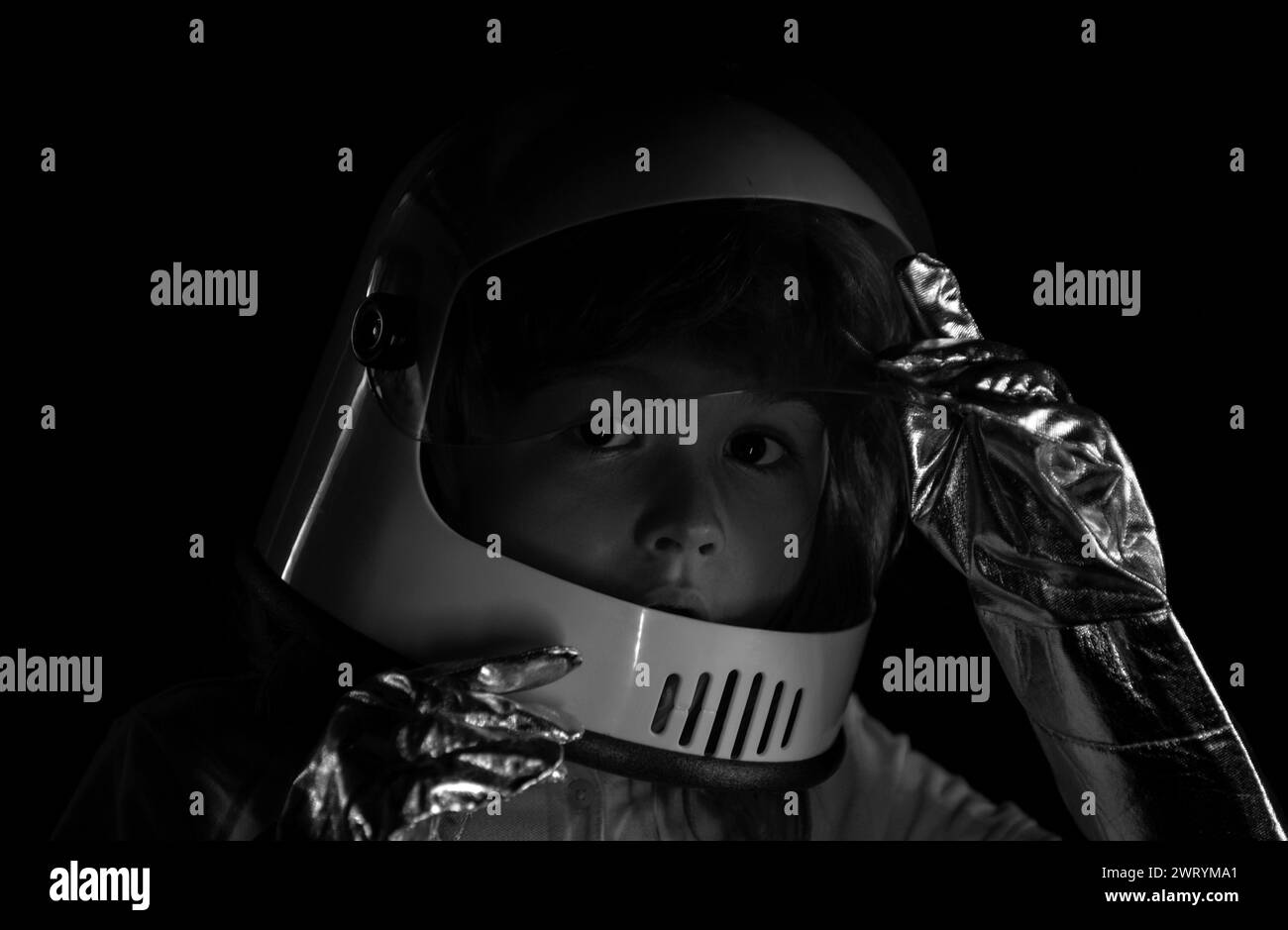 Space kids cosmonaut concept. Portrait of positive little boy wearing ...