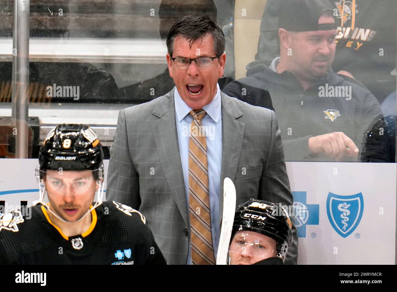 Pittsburgh Penguins head coach Mike Sullivan, center, yells ...