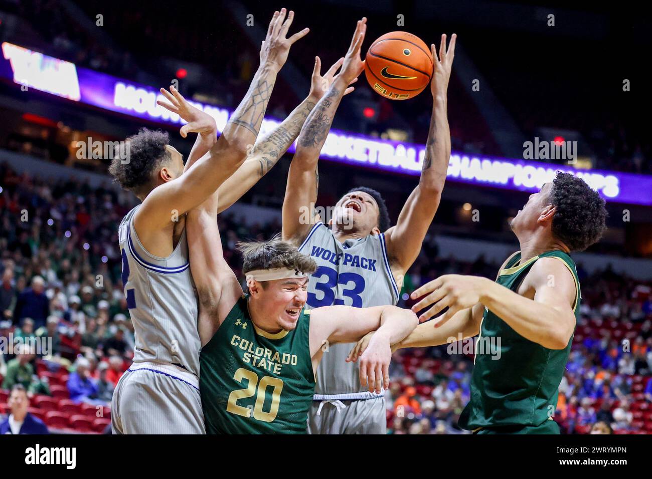 Nevada forward Tylan Pope (33) grabs a rebound over Colorado State ...