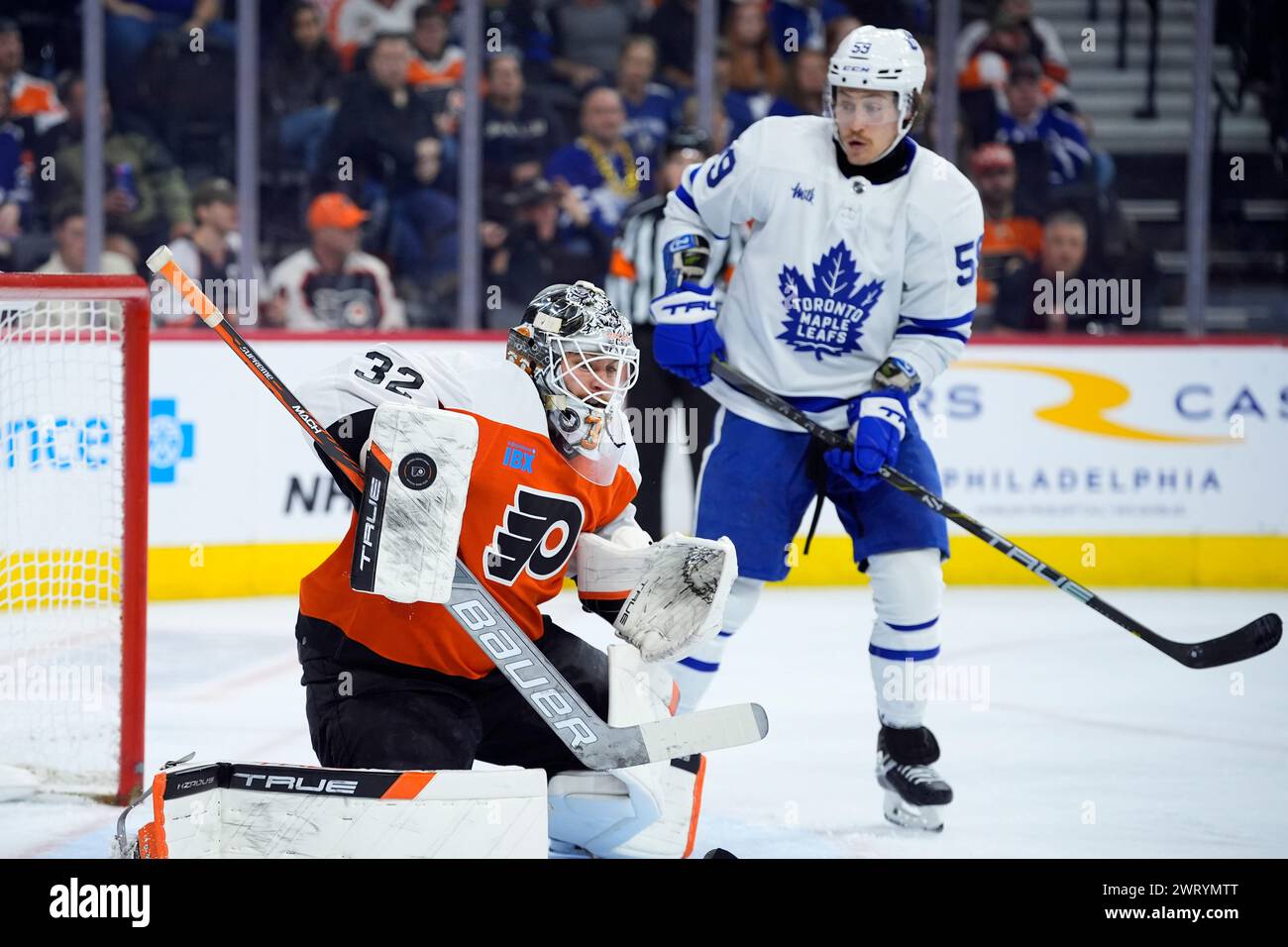 Philadelphia Flyers' Felix Sandstrom, left, blocks a shot as Toronto ...