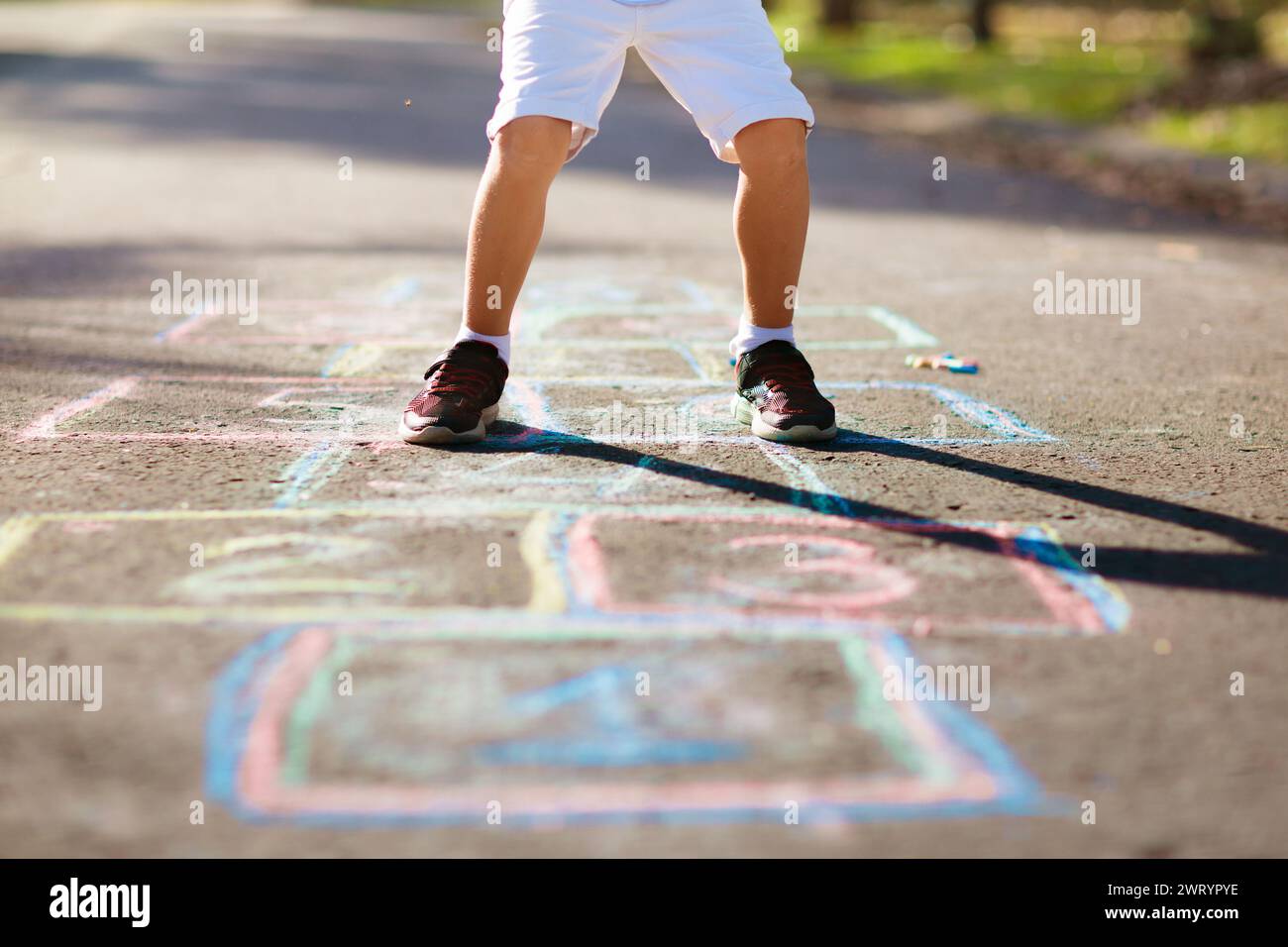 Kids play hopscotch in summer park. Healthy active outdoor game ...