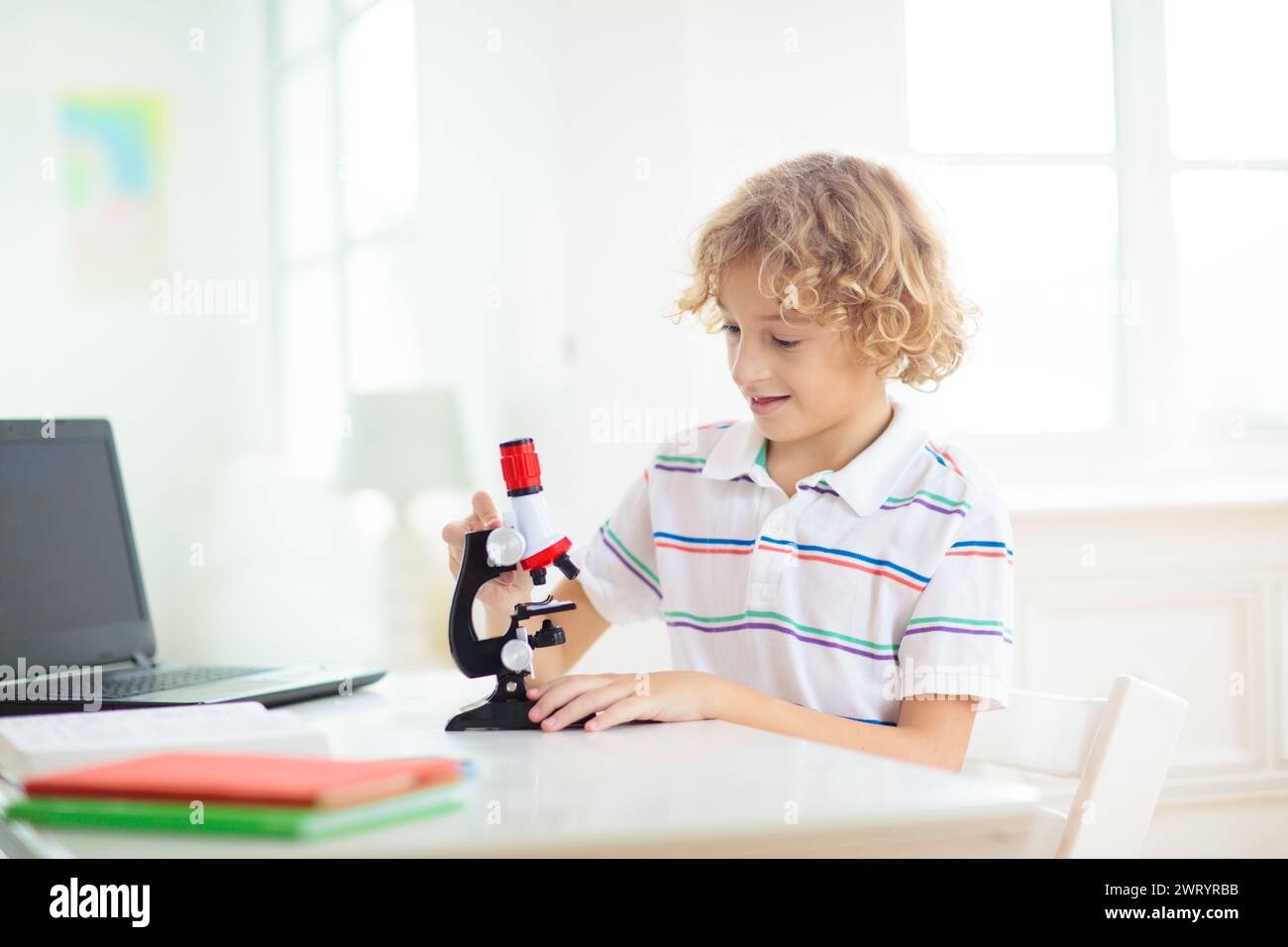 School kids with microscope. Science class. Children making biology or ...
