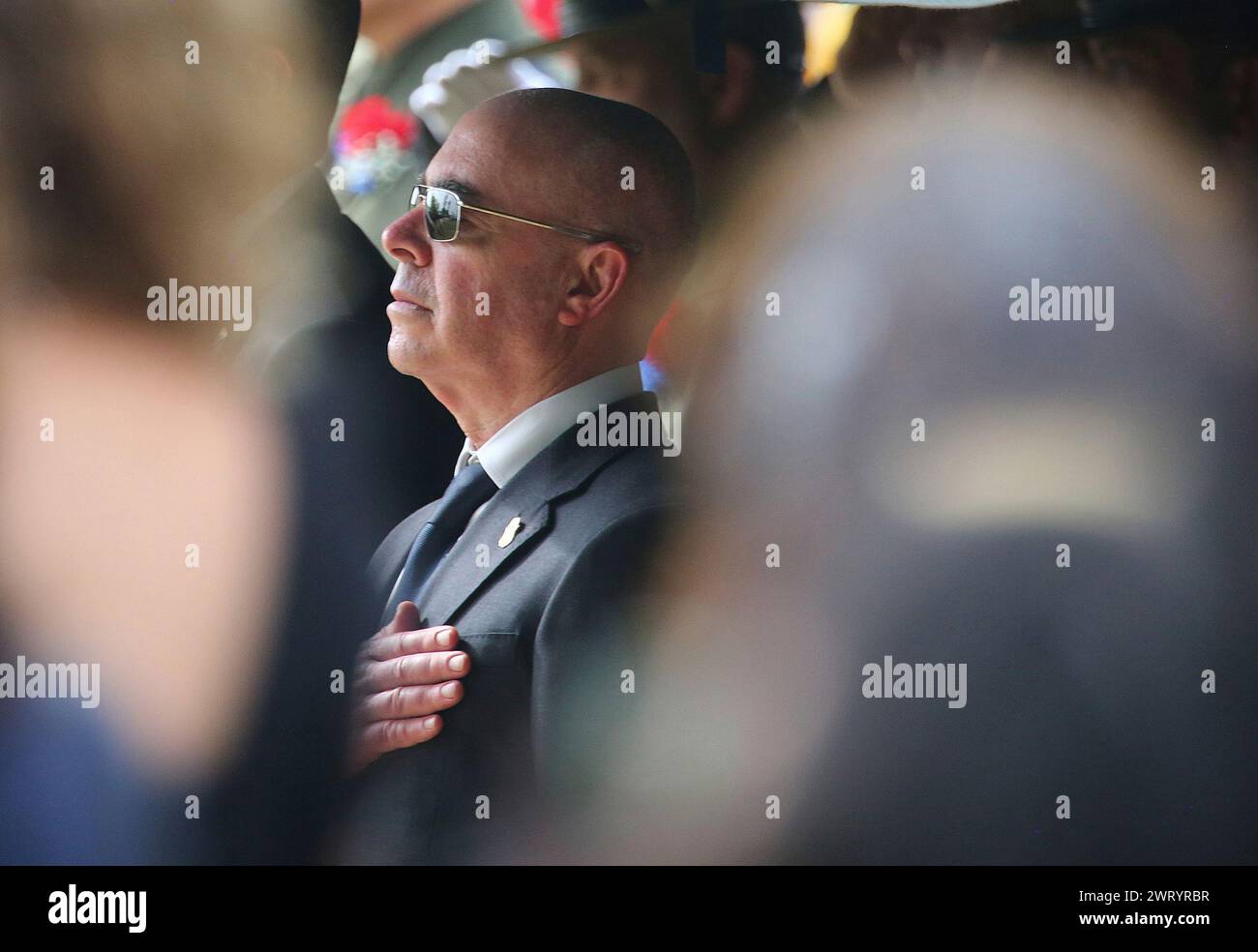 U.S. Secretary of Homeland Security Alejandro Mayorkas holds his hand ...
