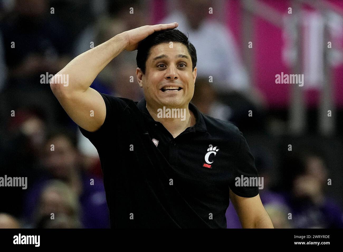 Cincinnati head coach Wes Miller motions to his players during the ...
