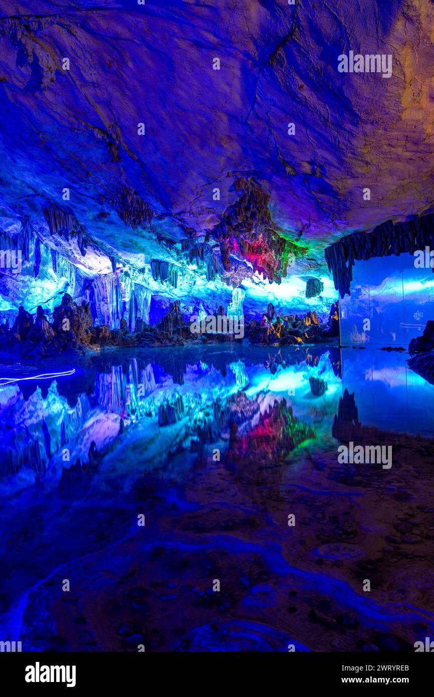 Underground lake in Reed Flute Caves in Guilin, China. Vertical image ...