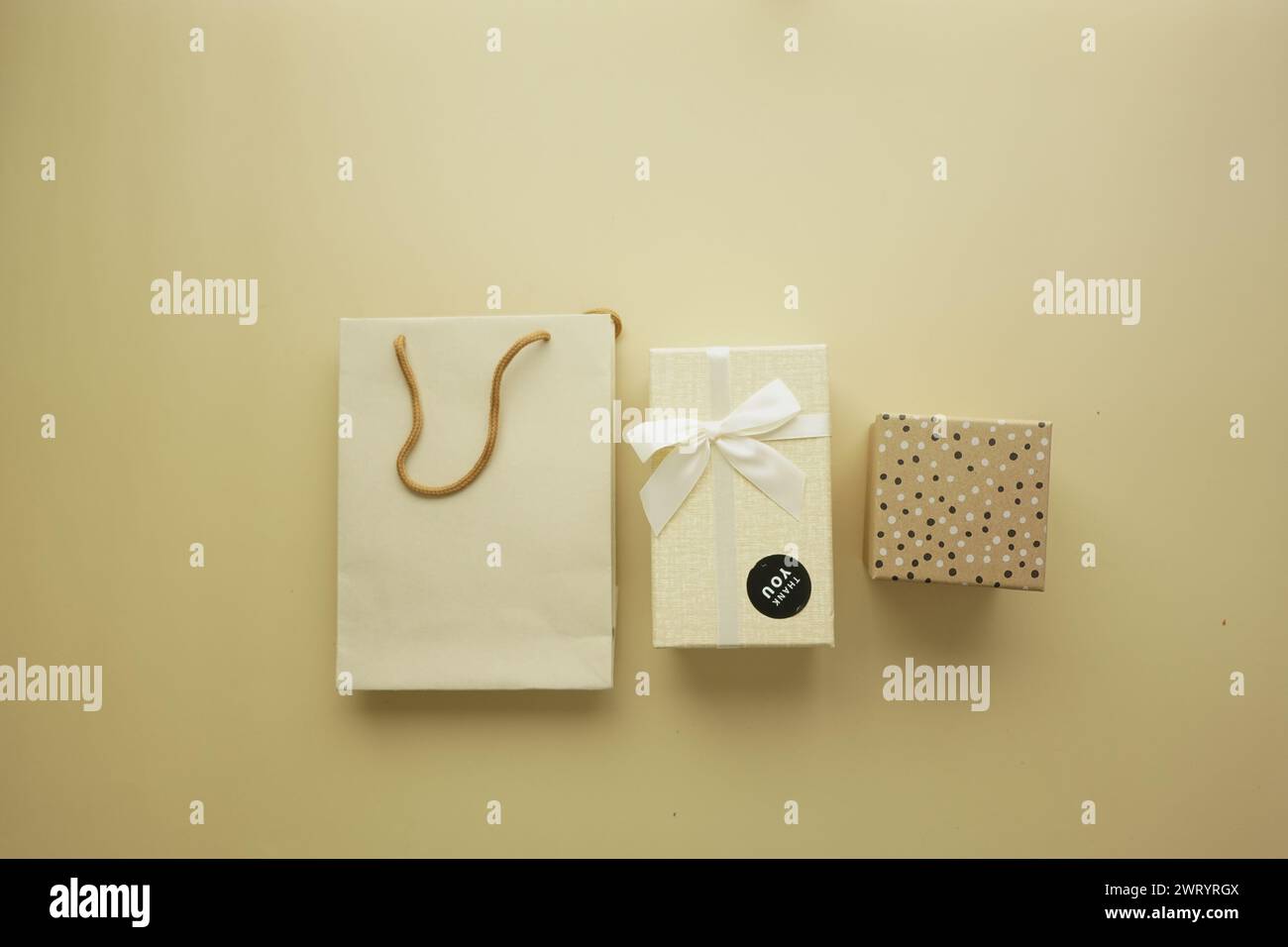 Gift or present box with paper packet on orange color background Stock ...