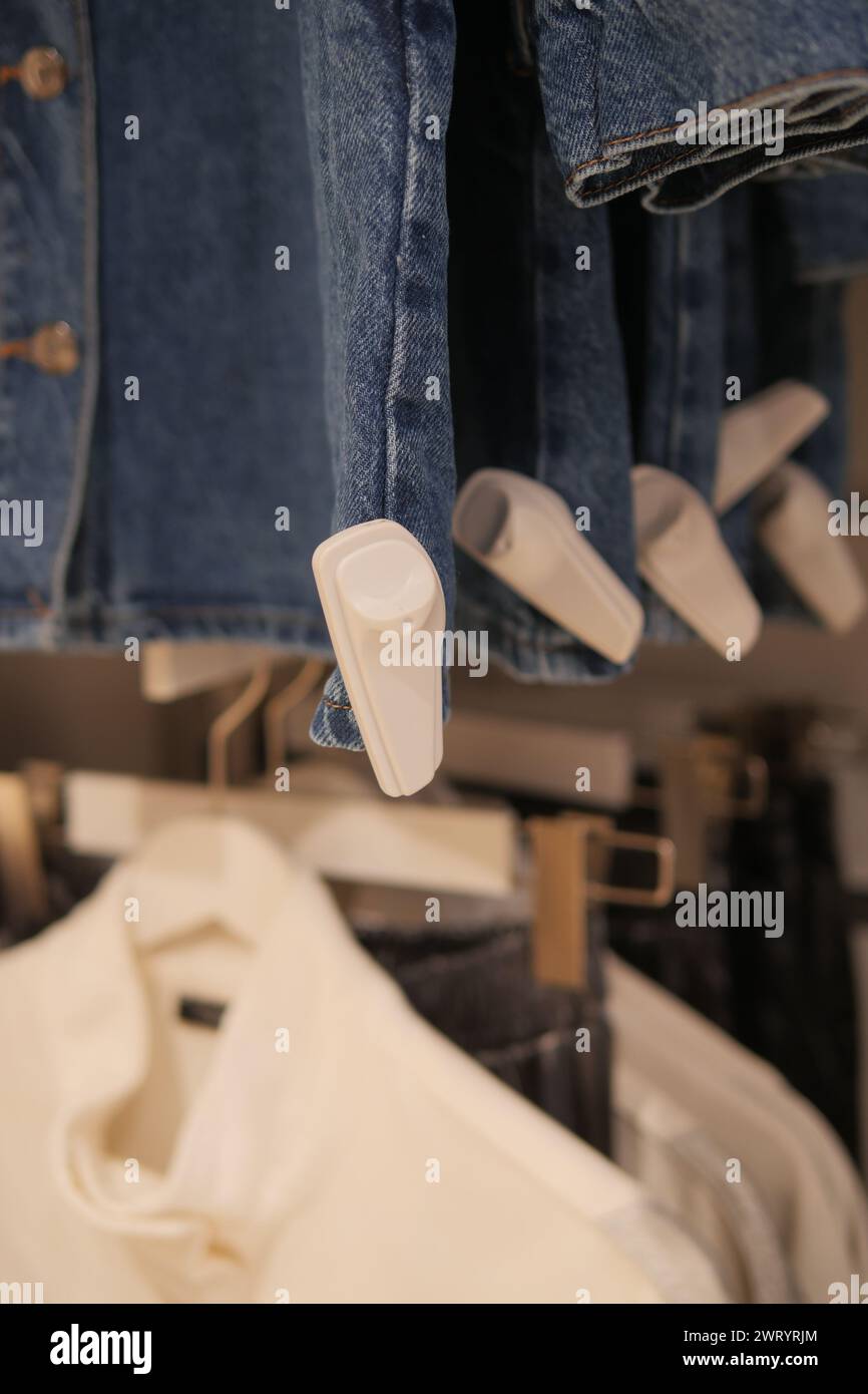 Clothing security tag on a shirt Stock Photo - Alamy