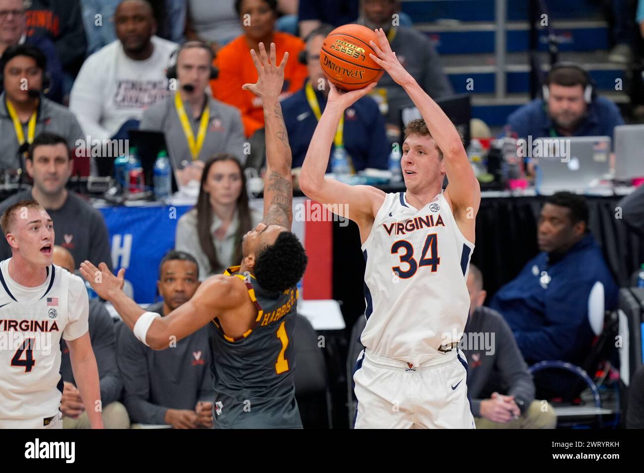 Virginia forward Jacob Groves (34) shoots over Boston College guard ...