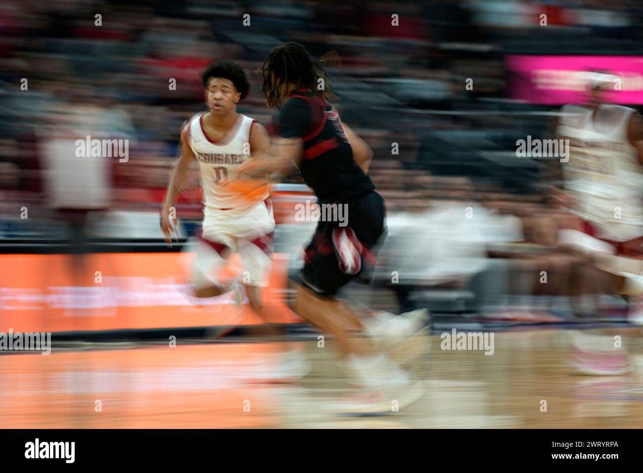 Washington State forward Jaylen Wells (0) drives up the court against ...