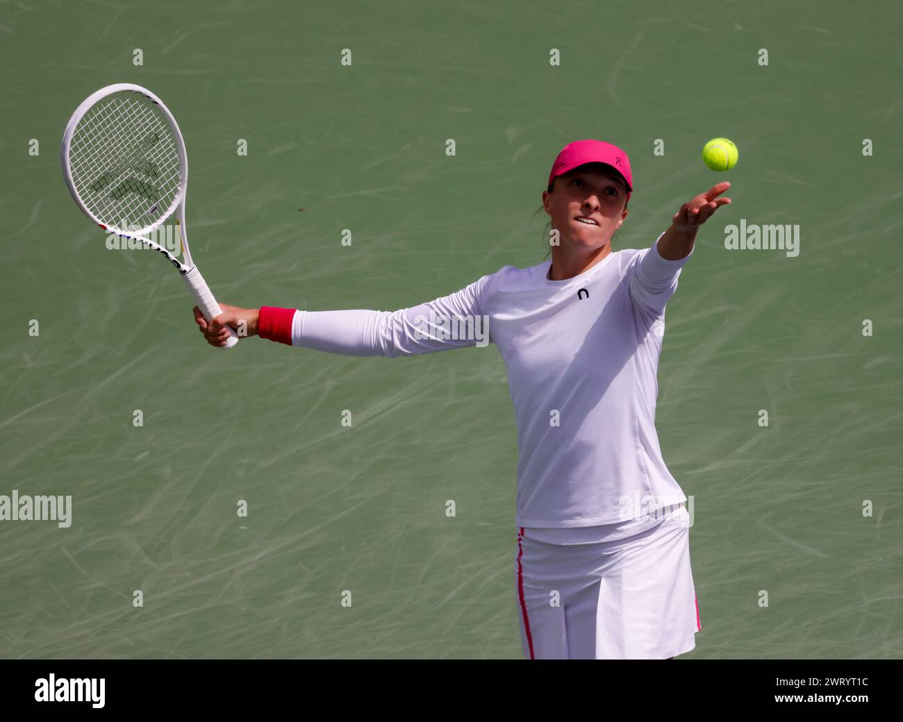 March 14, 2024 Iga Swiatek of Poland serves against Caroline Wozniacki ...