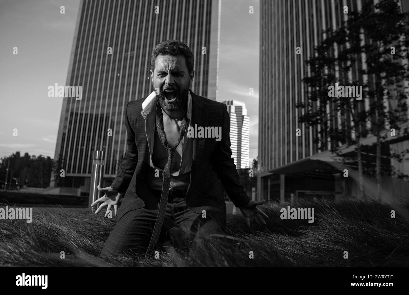 Business man lost in depression crying sitting on street suffering ...