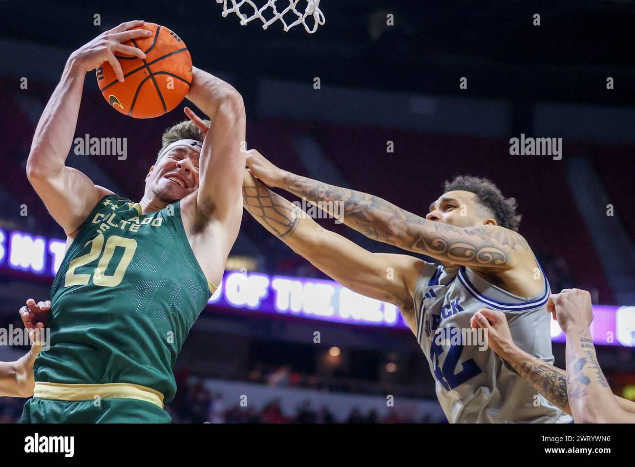 Colorado State guard Joe Palmer (20) grabs a rebound next to Nevada ...