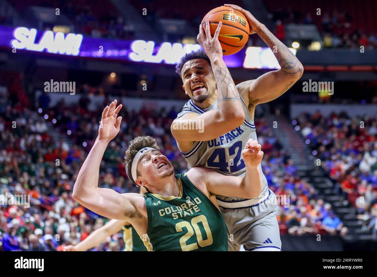 Nevada forward K.J. Hymes (42) grabs a rebound over Colorado State ...