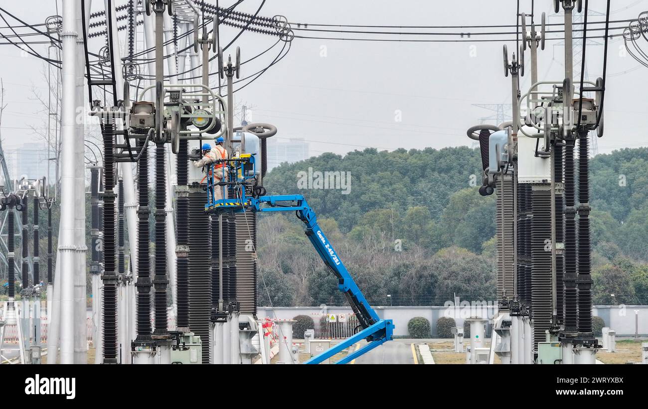 CHANGZHOU, CHINA - MARCH 15, 2024 - Construction workers remove a ...
