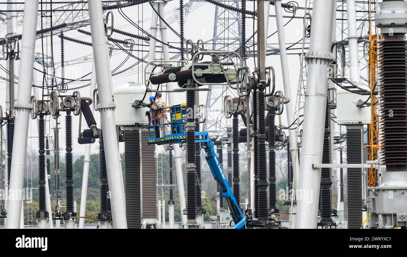 CHANGZHOU, CHINA - MARCH 15, 2024 - Construction workers remove a ...