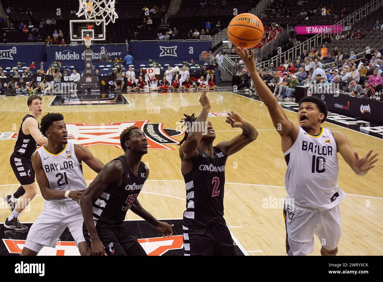 Baylor guard RayJ Dennis (10) shoots over Cincinnati guard Jizzle James ...
