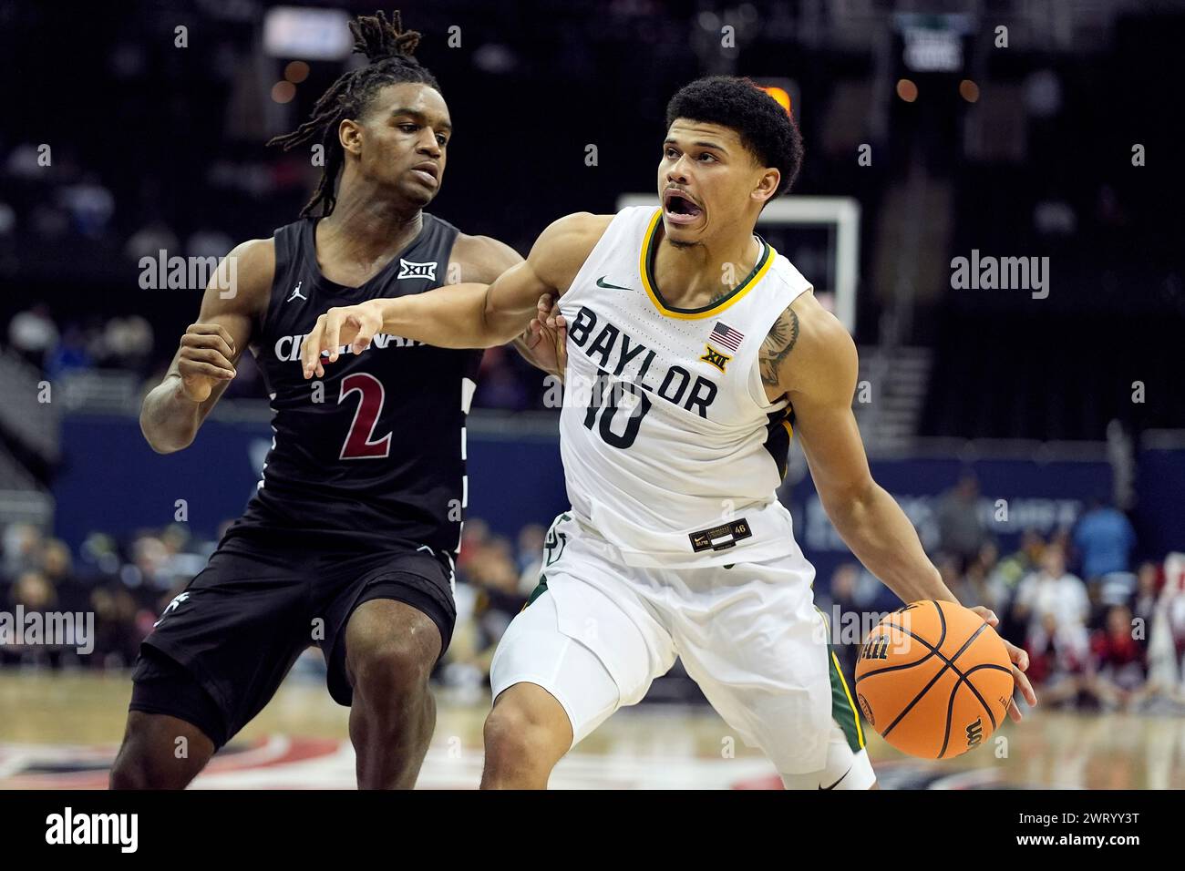 Baylor guard RayJ Dennis (10) is pressured by Cincinnati guard Jizzle ...