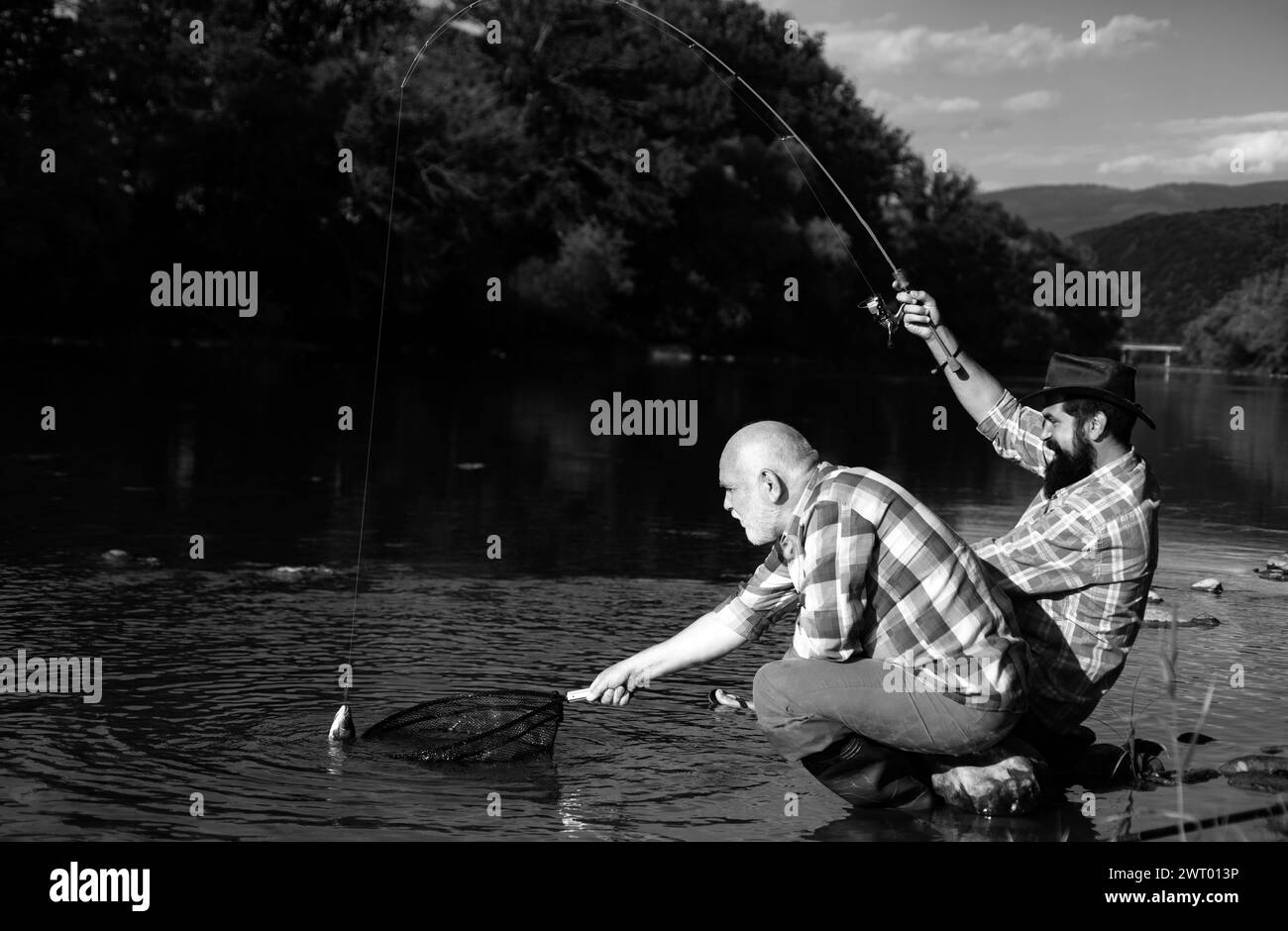 Fisherman men friends and trophy trout. Father and son fishing ...
