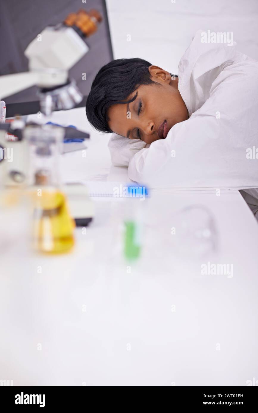 Nap, tired and woman scientist in laboratory working overtime on ...