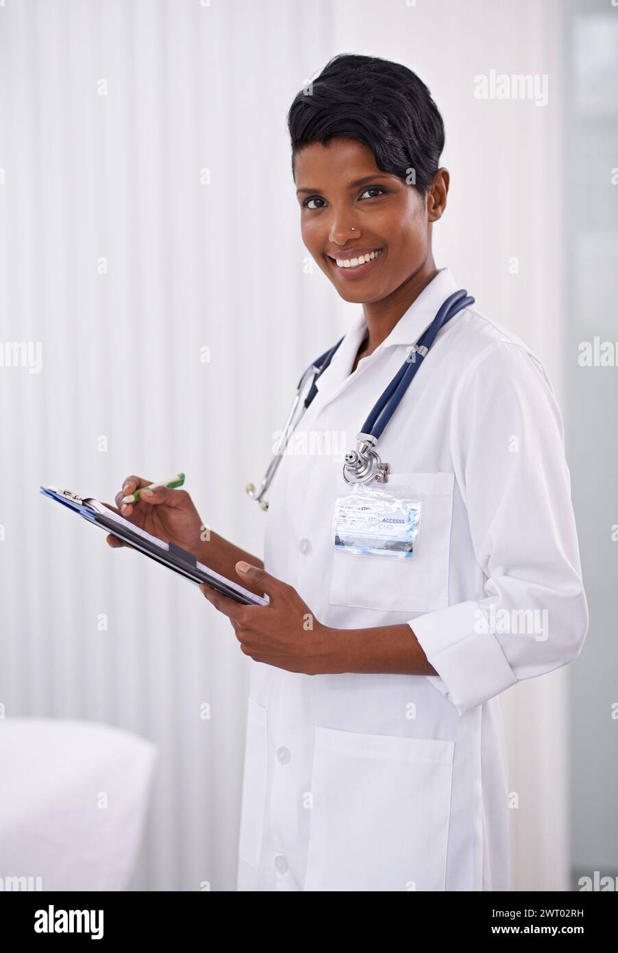 Portrait, doctor and happy woman writing on checklist in hospital for ...