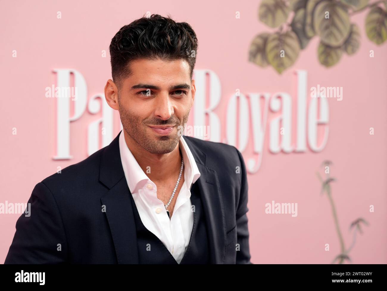 Jason Canela poses at the premiere of the Apple TV+ series "Palm Royale ...