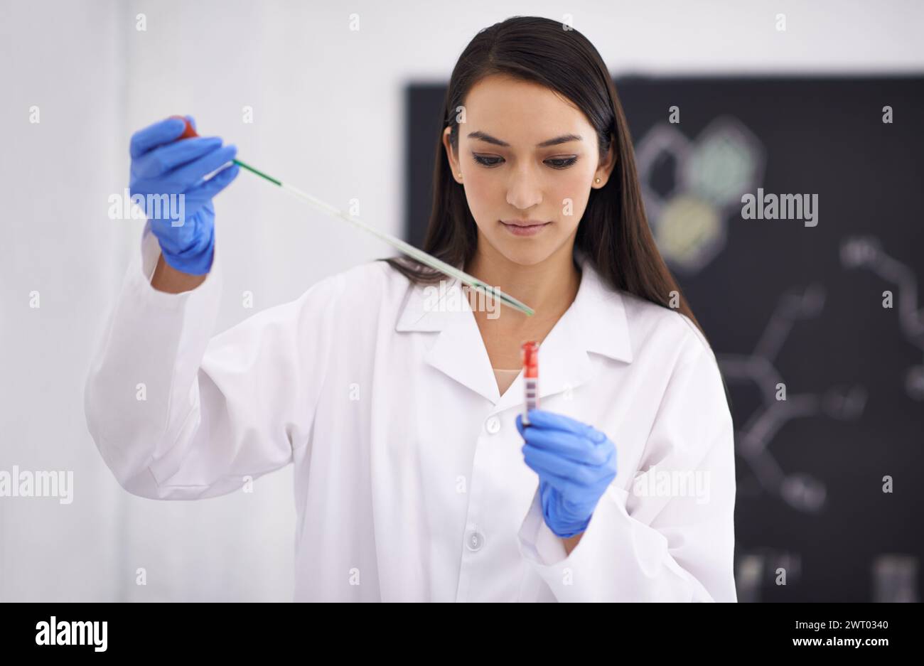 Woman, laboratory and science research with test tube or medical ...
