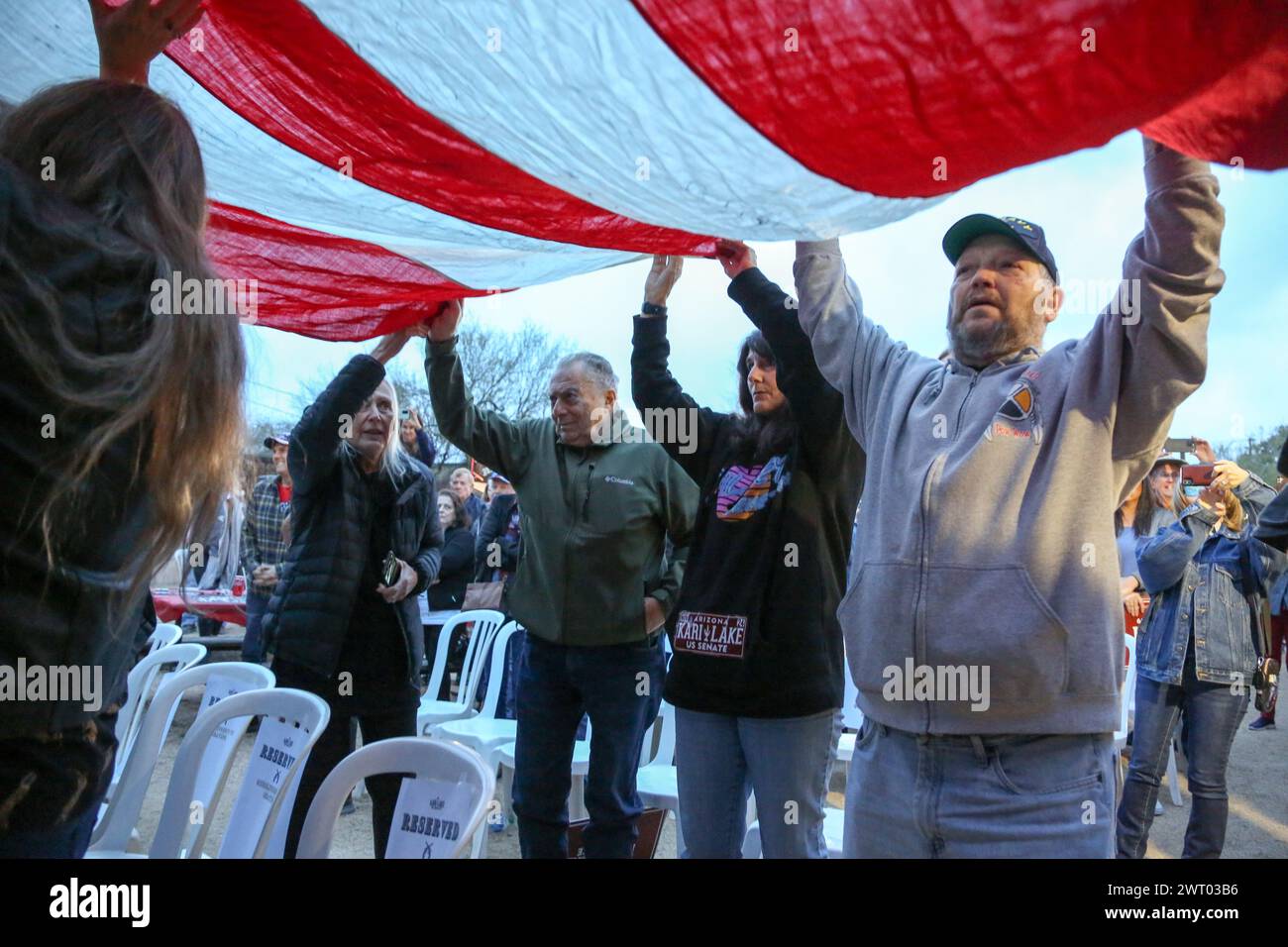 The flag from the US Arizona gets unfurled amongst the audience before ...