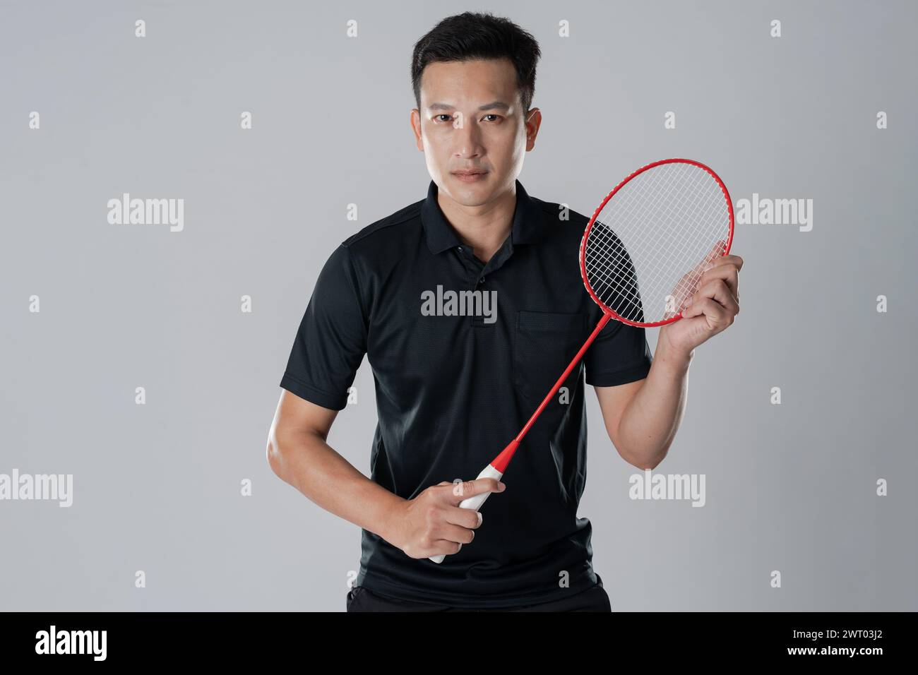 Badminton player wearing sportswear standing holding a racket in the ...