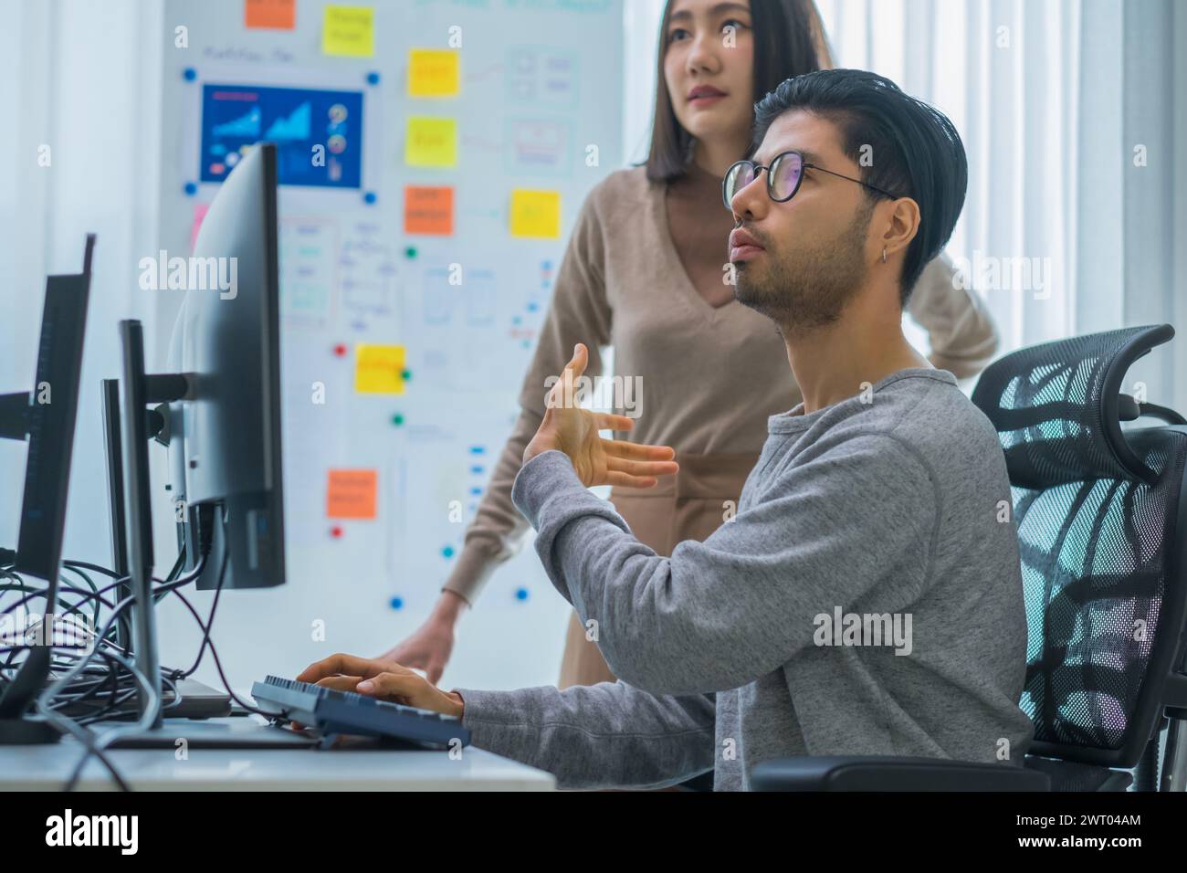 Asian And Indian Developer Team Discussion Feedback Analysis Coding Data With Software Computer