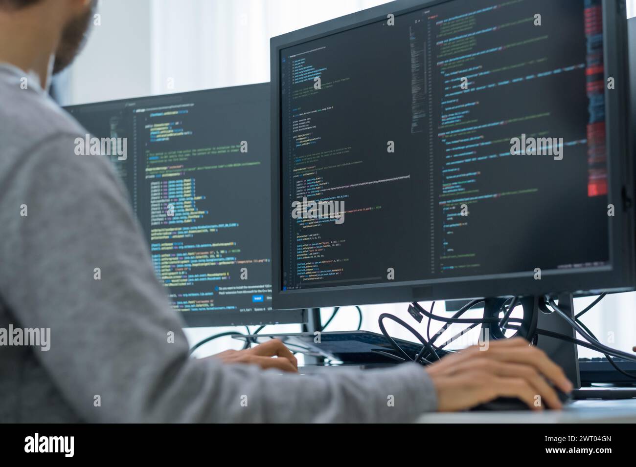 Asian Prompt Engineer Developer Coding App With Software Data Sitting In Front Of Computer
