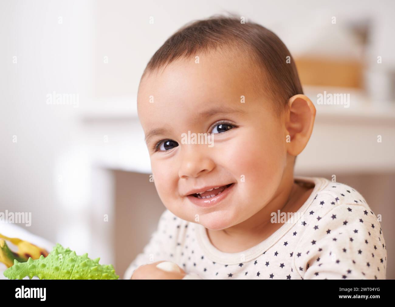 Baby, toddler portrait and toy in home, childhood and care for ...