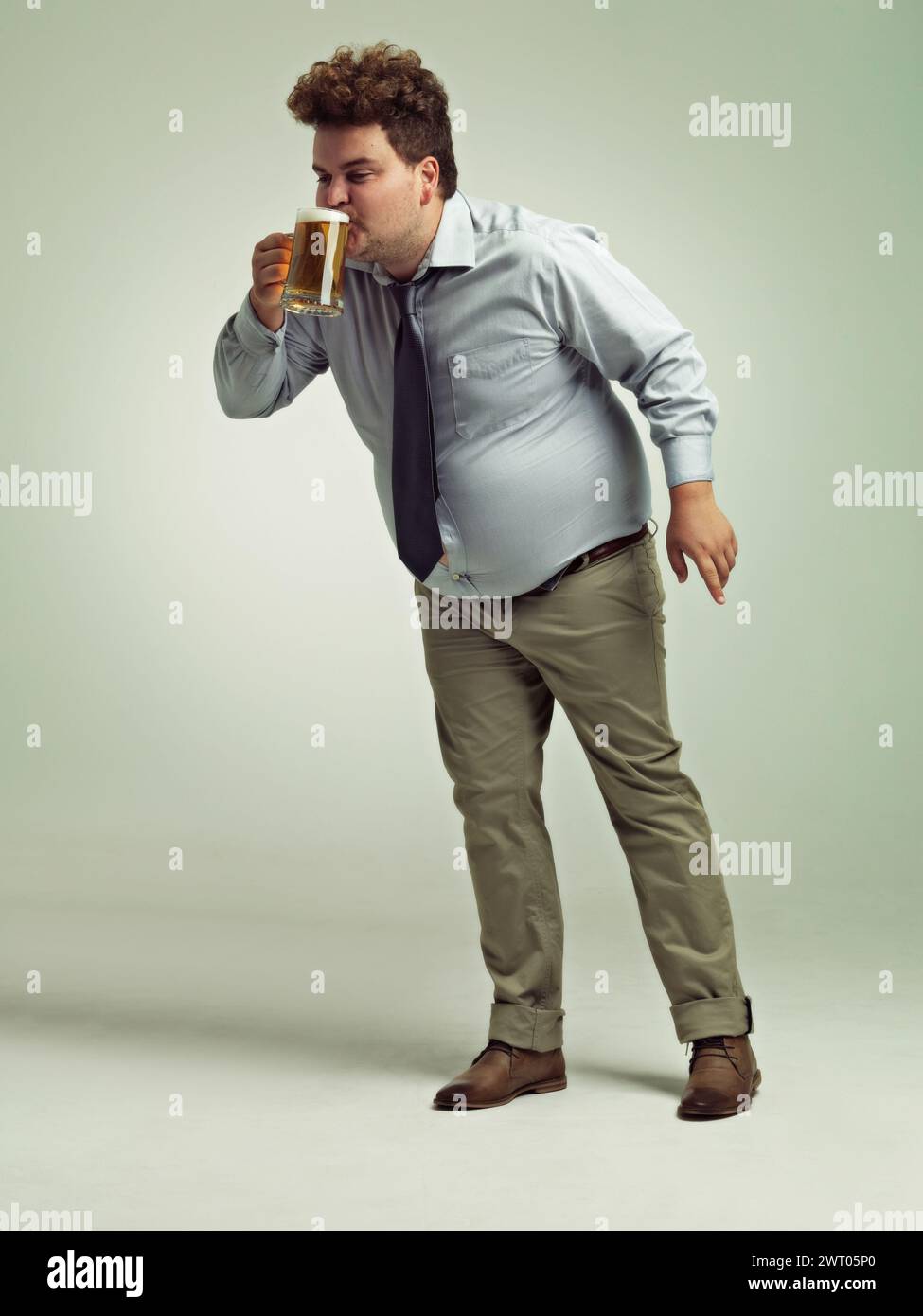 Man, obesity and drinking with beer for alcohol, belly or party on a ...