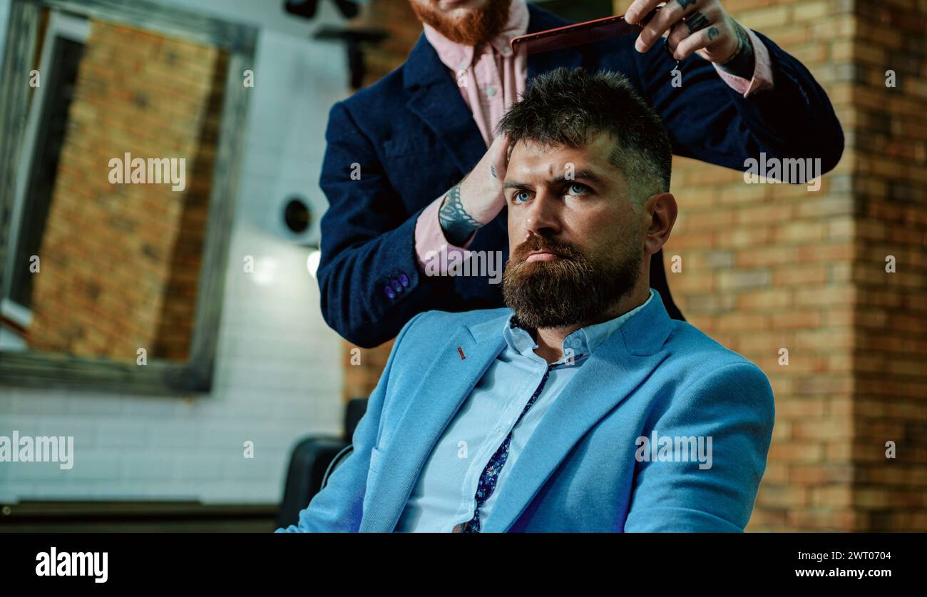 Hair style and hair stylist. Barber making haircut of attractive ...