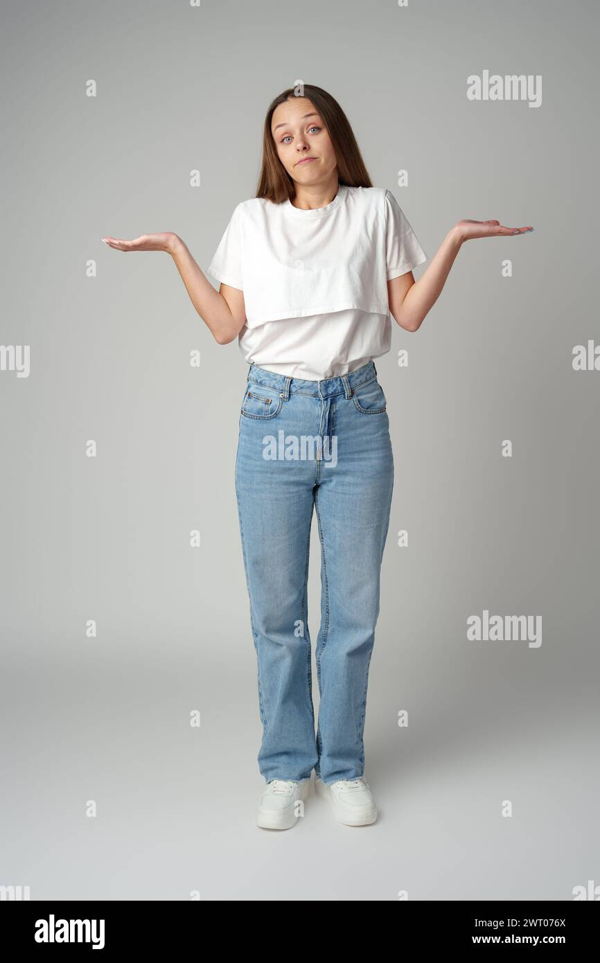 Clueless young worried woman dont know what to say, has no answer on ...