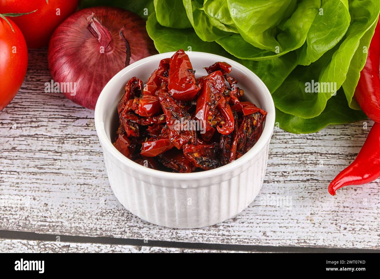 Dry tomato with olive oil in the bowl Stock Photo - Alamy